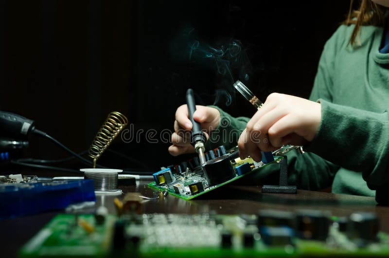 Repair of Electronic Devices, Tin Soldering Parts. Solderer Stock Photo ...