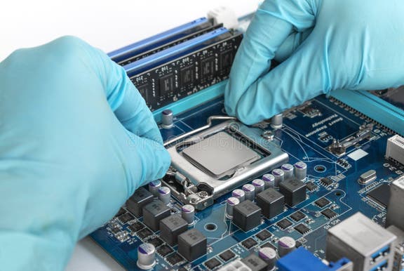 A Repair Engineer Installs a Processor Chip into a Circuit Board Socket ...