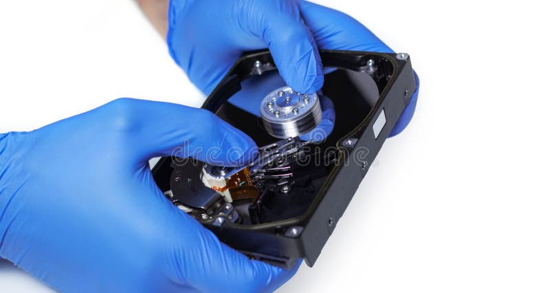 Repair Hard Disk. Hands of Master in Gloves Repair the Computer Hard ...