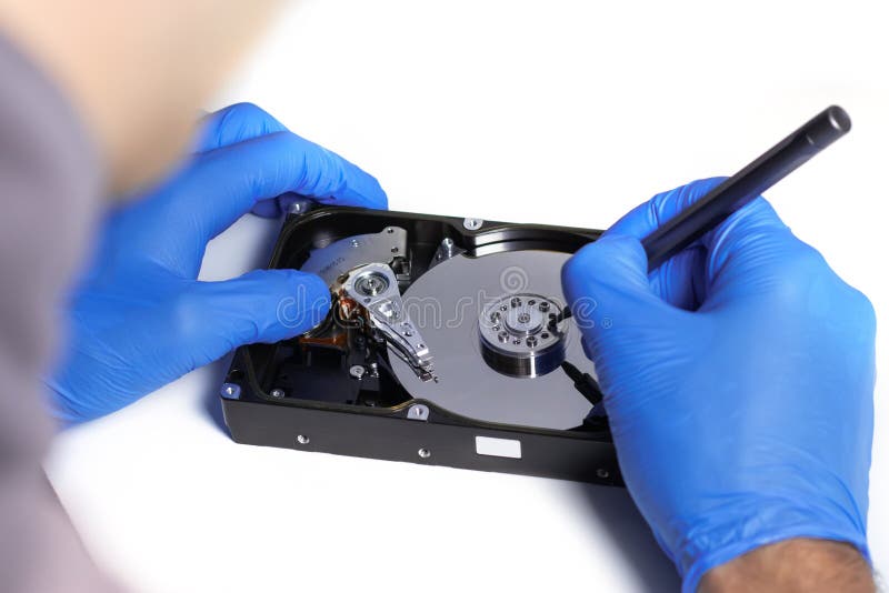 Repair Hard Disk. Hands of Master in Gloves with Screwdriver Repair the ...