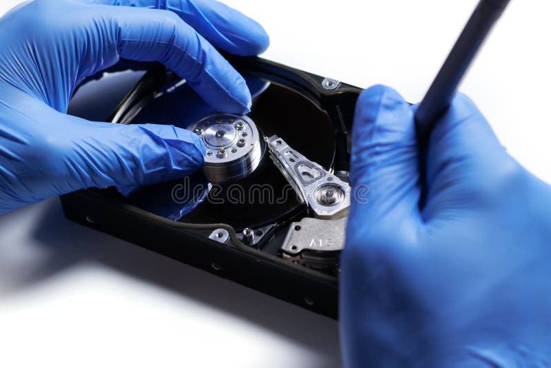 Repair Hard Disk. Hands of Master in Gloves with Screwdriver Repair the ...