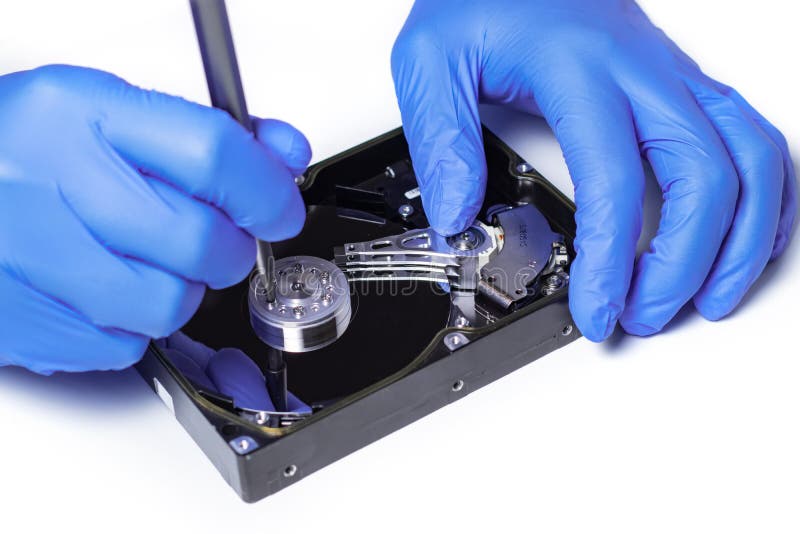 Repair Hard Disk. Hands of Master in Gloves with Screwdriver Repair the ... Repair Hard Disk. Hands of Master in Gloves with Screwdriver Repair the ...