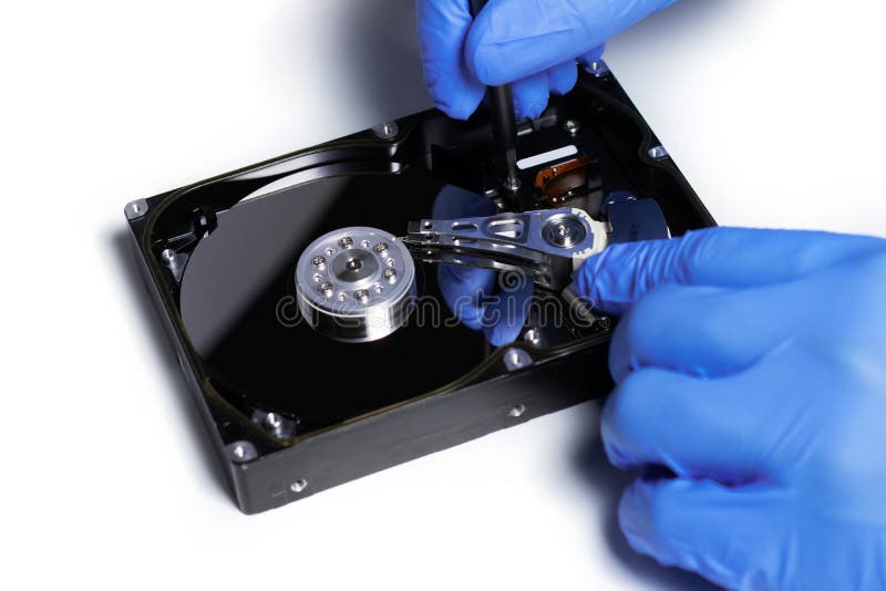 Repair Hard Disk. Hands of Master in Gloves with Screwdriver Repair the ...