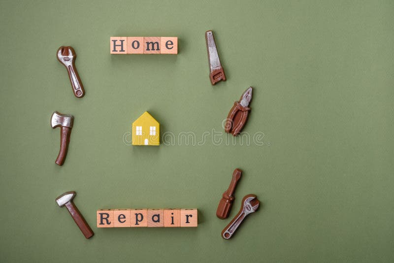 Repair or Home Improvement Tools and a House Model on a Plain ...