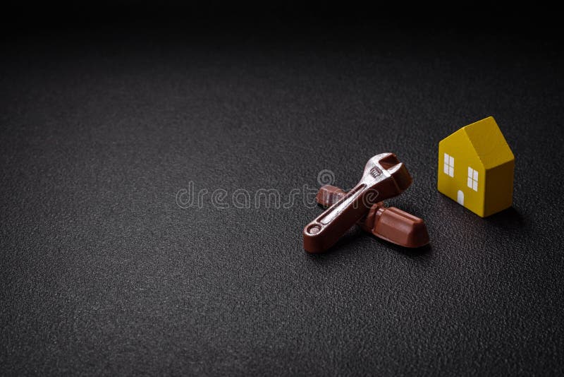 Repair or Home Improvement Tools and a House Model on a Plain ...