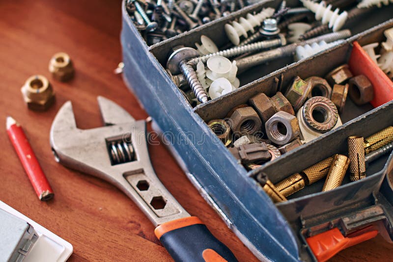 Repair Kit and Adjustable Wrench on the Table Stock Photo - Image of ...