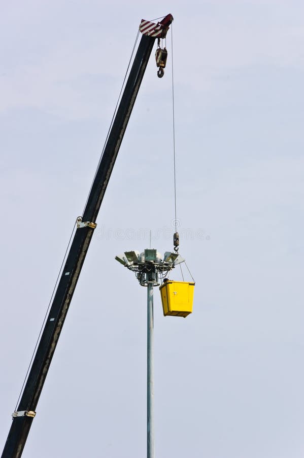 Repair of lights on a pole stock photo. Image of lift - 24996704