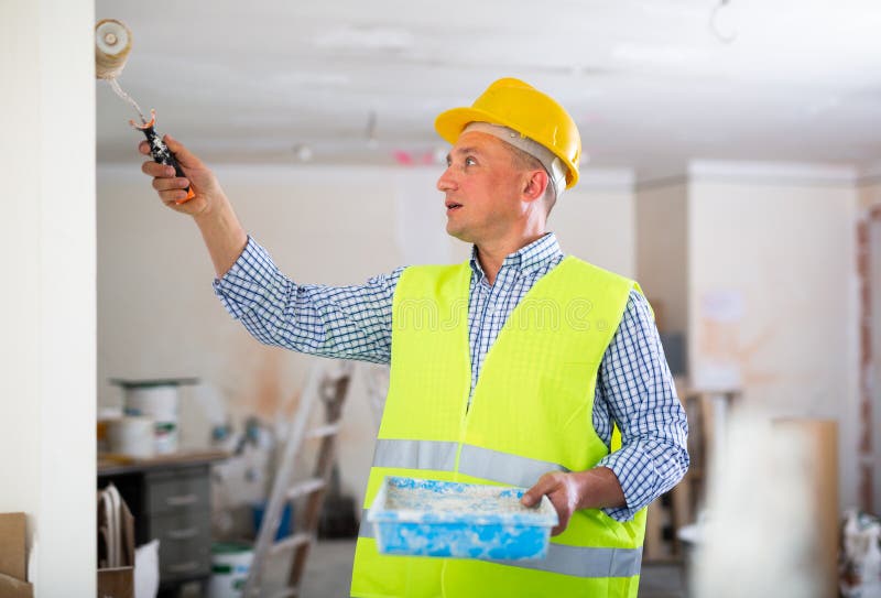 Repair Man Measuring Evenness of Wall Stock Photo - Image of painter ...