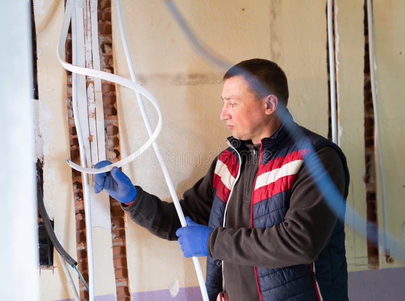 Repair Man Lying Down Cable Duct in Room Stock Image - Image of service ...