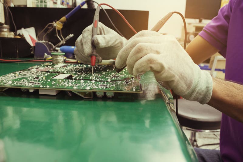 The Repair Man Using Digital Multimeter Measurement on Circuit of PCB ...
