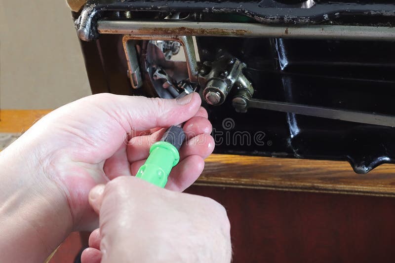 Repair of an Old Sewing Machine Stock Photo - Image of worker, master ...