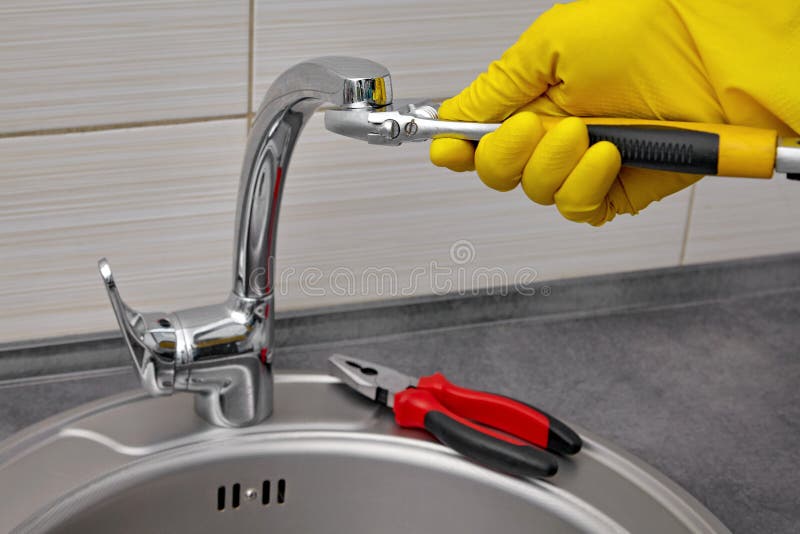 Repair of Plumbing Equipment in the Kitchen. Replacing the Water ...