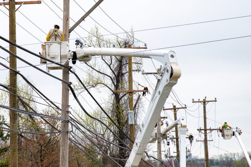 Repair of Power Lines Work at Height in Helmets on Crane in Cradle ...