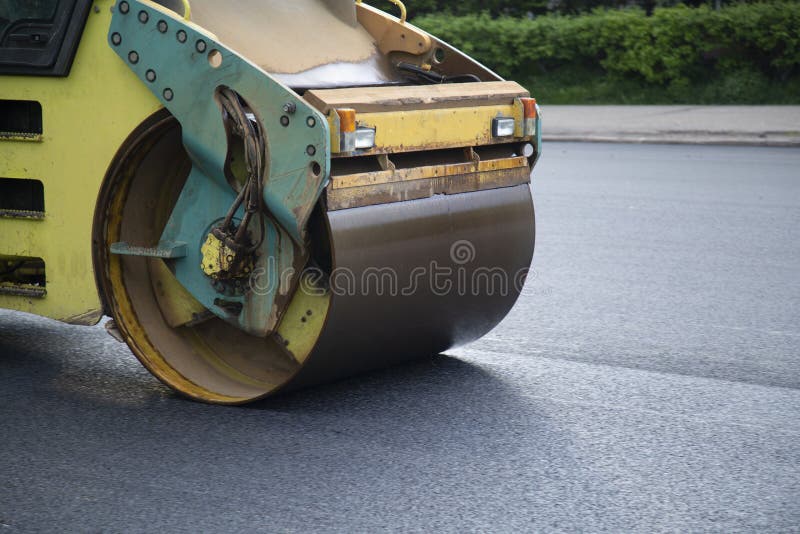 Repair of Roads. Laying Asphalt with a Roller Stock Photo - Image of ...