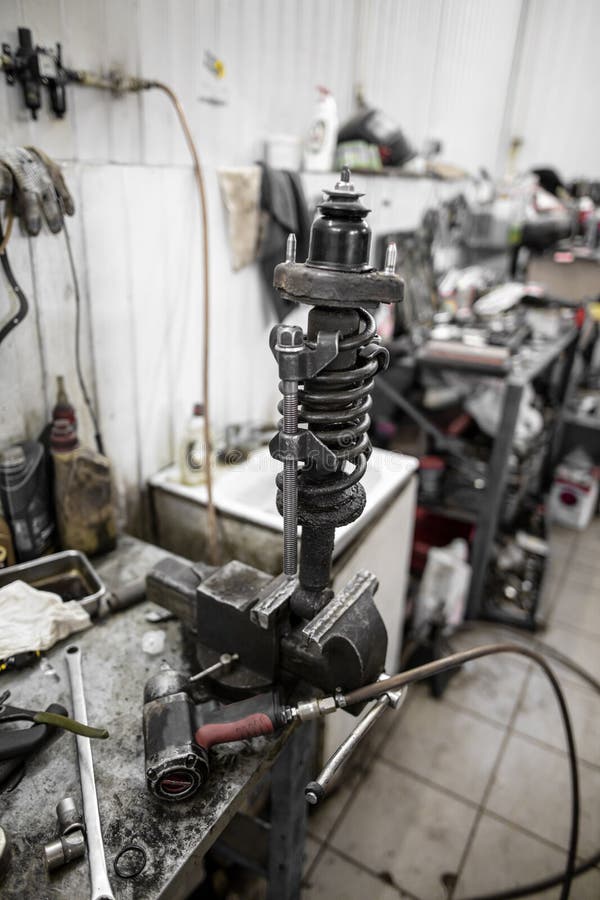 Repair of a Shock Absorber on a Car. Stock Image - Image of technology ...