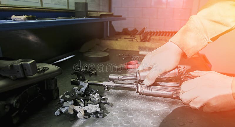 Repair of Small Arms in a Special Workshop. Details in the Hands of a ...