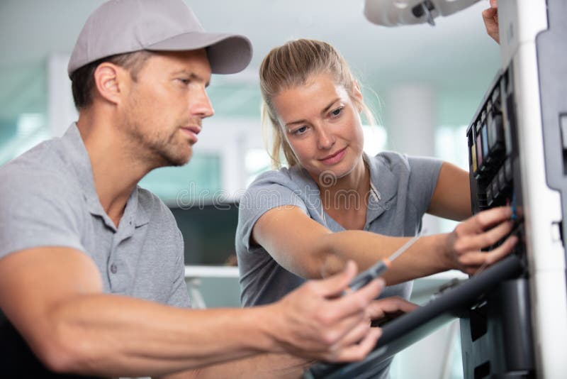 Repair Team Working on Industrial Printer Stock Photo - Image of ...