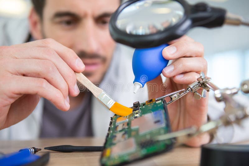 Repair Technician Soldering Electrical Parts on Motherboard Stock Image ...