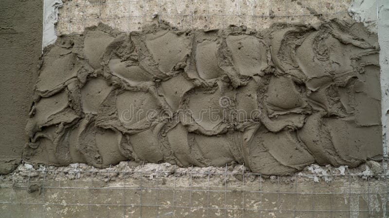 Repair of Walls Using Cement Composition. Putty with Moldings on the ...