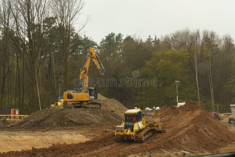 Repair Work on the Road. Working Excavator and Bulldozer Stock Image ...