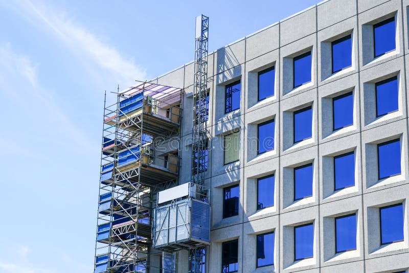 Repair Works of a Modern Office Building Using Scaffolding with ...
