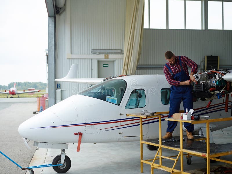 Airplane Mechanic Fixing Chassis Stock Photo - Image of crew ...
