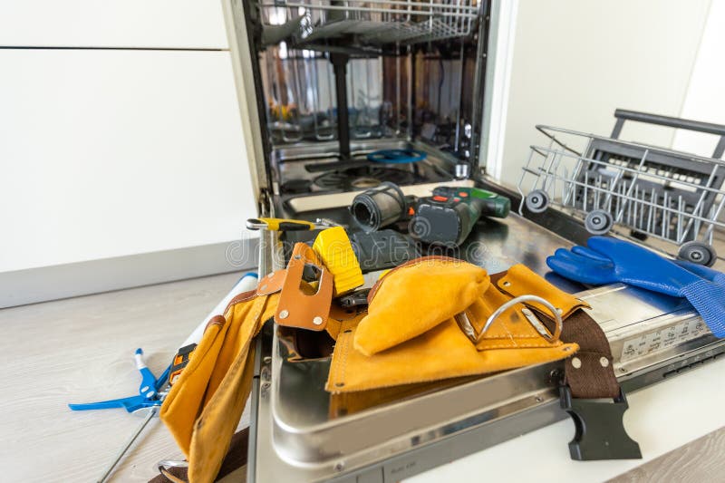 Repairing a Dishwasher with Tools Stock Photo - Image of indoors ...