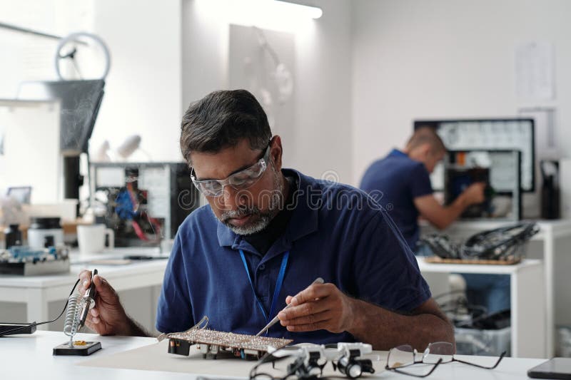 Repairing Electronic Device in Technology Workshop Stock Image - Image ...