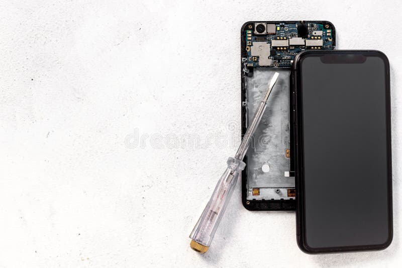 Repairing Electronics Circuit Board - Mobile Phone with Microchips ...