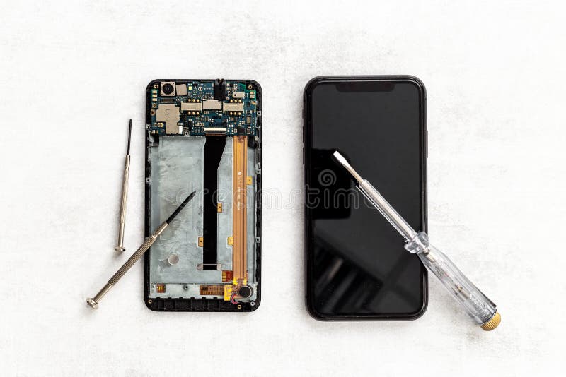 Repairing Electronics Circuit Board - Mobile Phone with Microchips ...