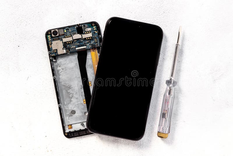 Repairing Electronics Circuit Board - Mobile Phone with Microchips ...