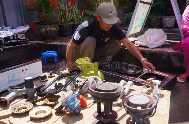 Repairing gas stove editorial image. Image of people - 48662090