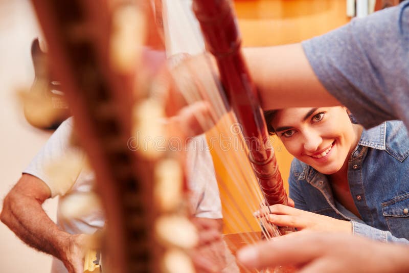 Repairing harp at workshop stock image. Image of people - 120482899