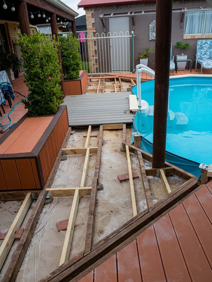 Repairing and Installing New Decking Around a Swimming Pool Stock Image ...