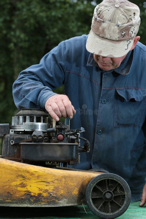 Repairing Lawn Mower Engine Stock Image - Image of mowing, mechanic ...