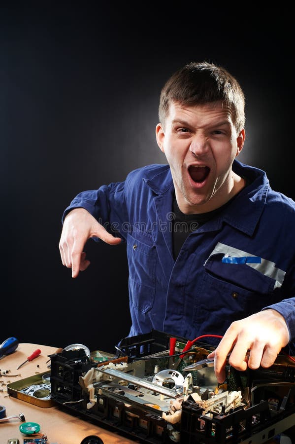 Repairing man in blue robe stock image. Image of inside - 18548667