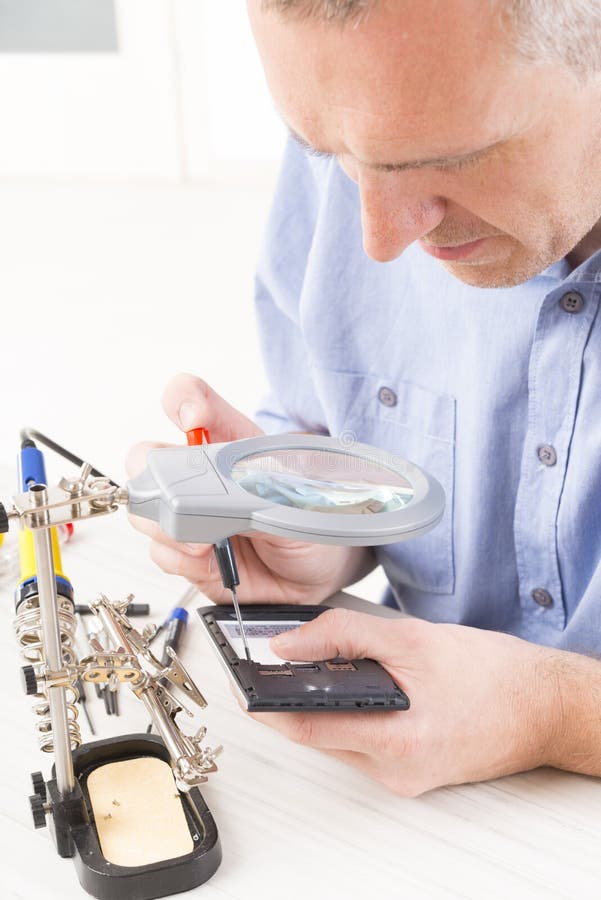 Repairing Mobile Phone in the Electronic Workshop Stock Image - Image ...
