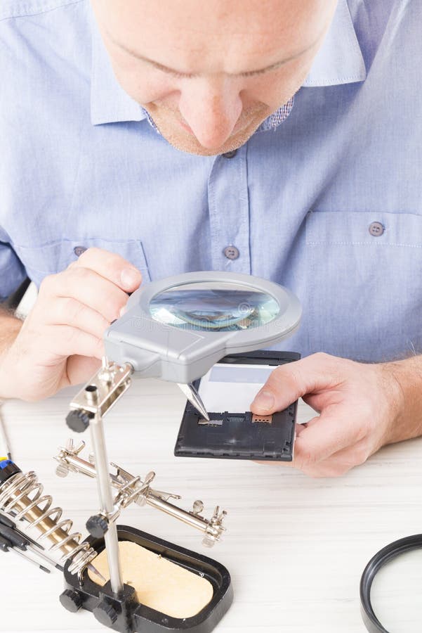 Repairing Mobile Phone in the Electronic Workshop Stock Image - Image ...
