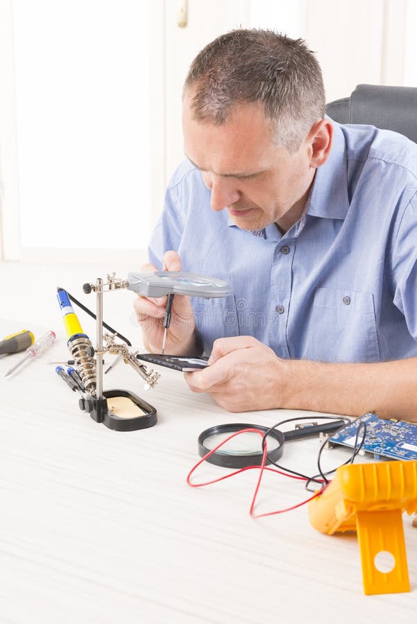 Repairing Mobile Phone in the Electronic Workshop Stock Image - Image ...