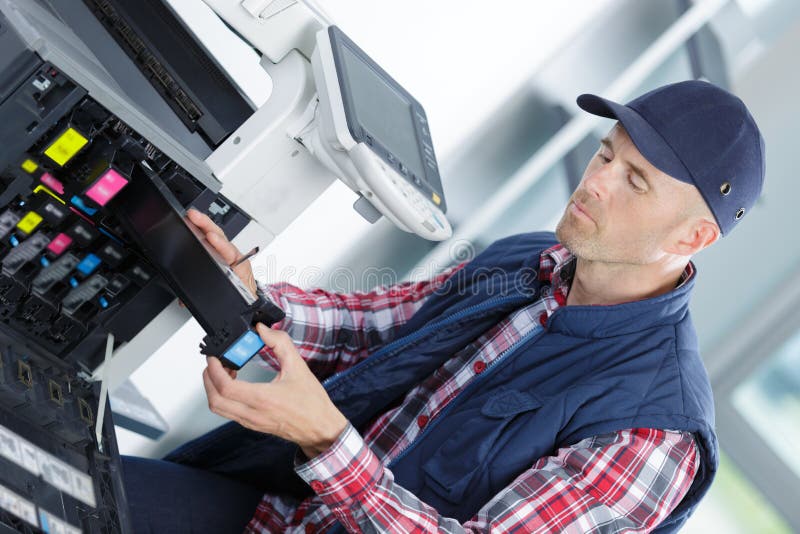 Repairing printer at work stock photo. Image of profession - 84259670