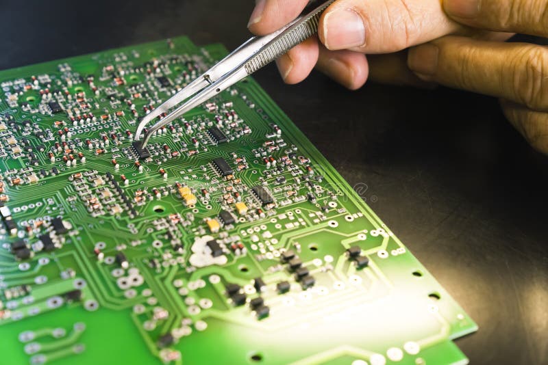 Repairing Process of a Broken PCB. Professional Caucasian Engineer ...