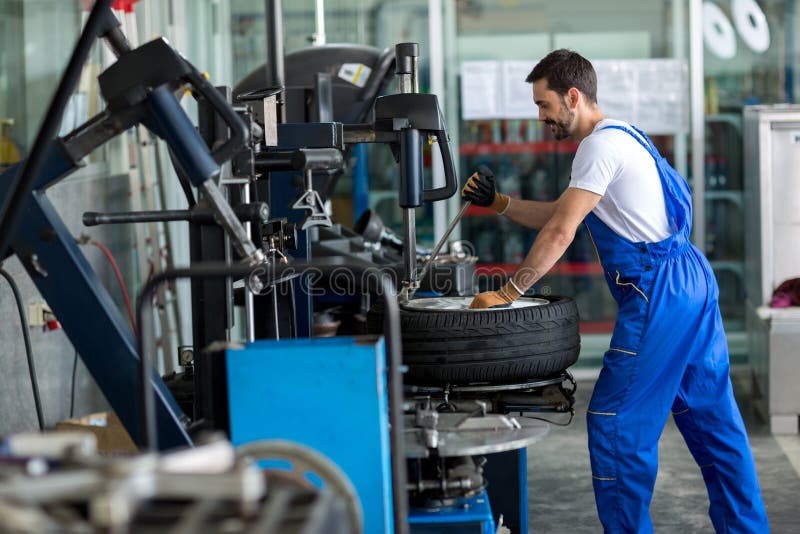 Repairman Balancing Car Wheel on Balancer Stock Image - Image of change ...