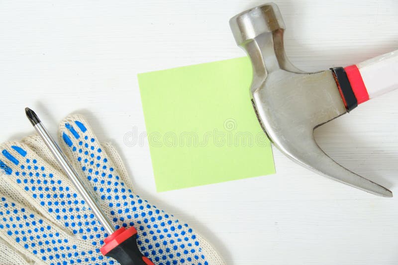 Repairman and Builder Tools on a Wooden Background White with a Green ...