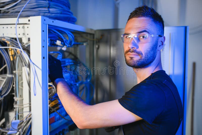 Repairman is Busy and Working with Internet Equipment and Wires in ...