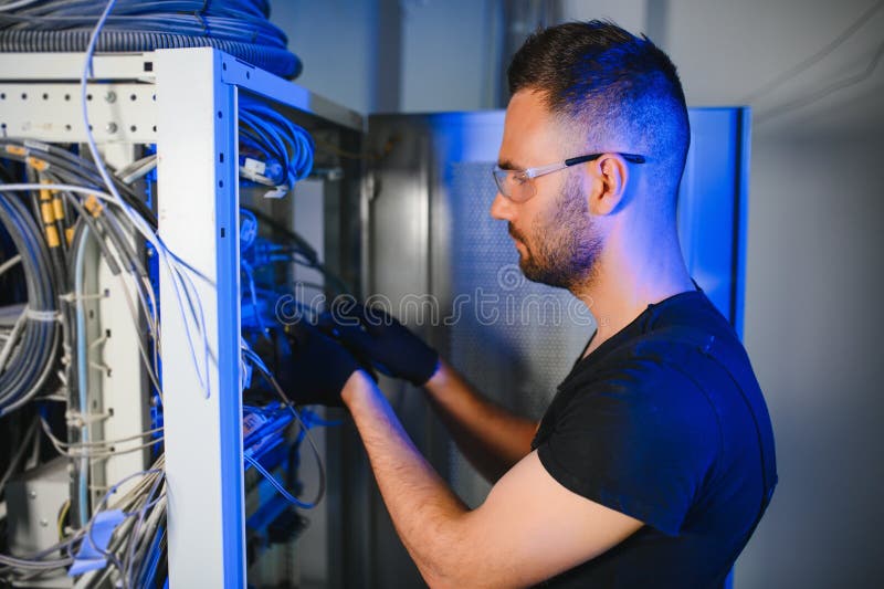 Repairman is Busy and Working with Internet Equipment and Wires in ...