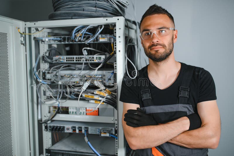 Repairman is Busy and Working with Internet Equipment and Wires in ...