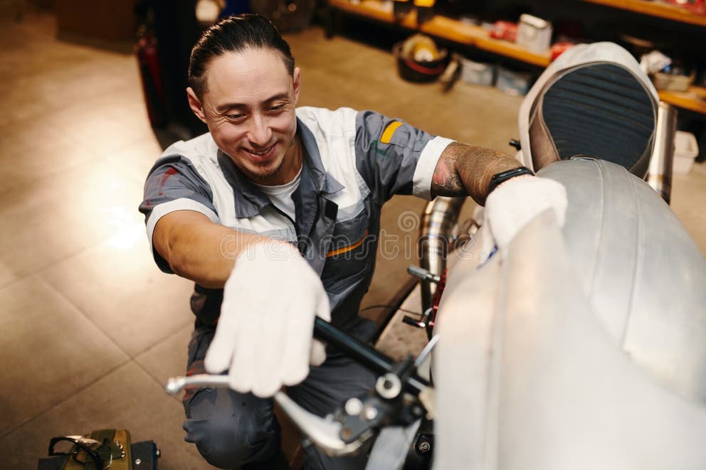 Repairman Checking Motorcycle Leverage Stock Photo - Image of repairman ...