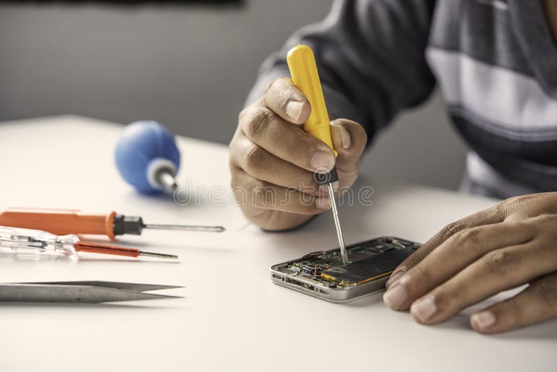 Repairman Disassembling Repairman Disassembling Smartphone with Stock ...