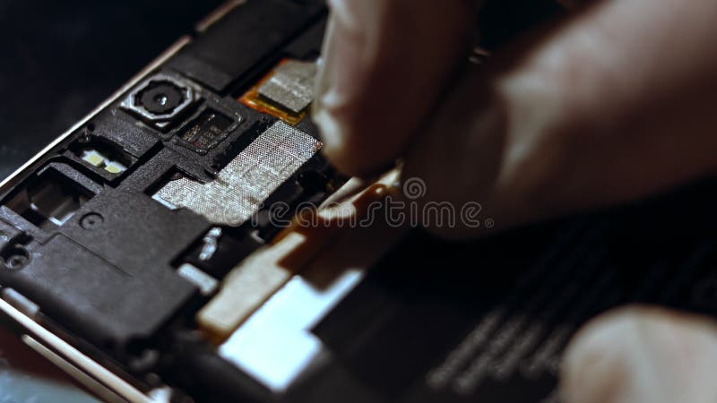Service Man Disassembling Broken Smartphone for Fixing in Repair ...