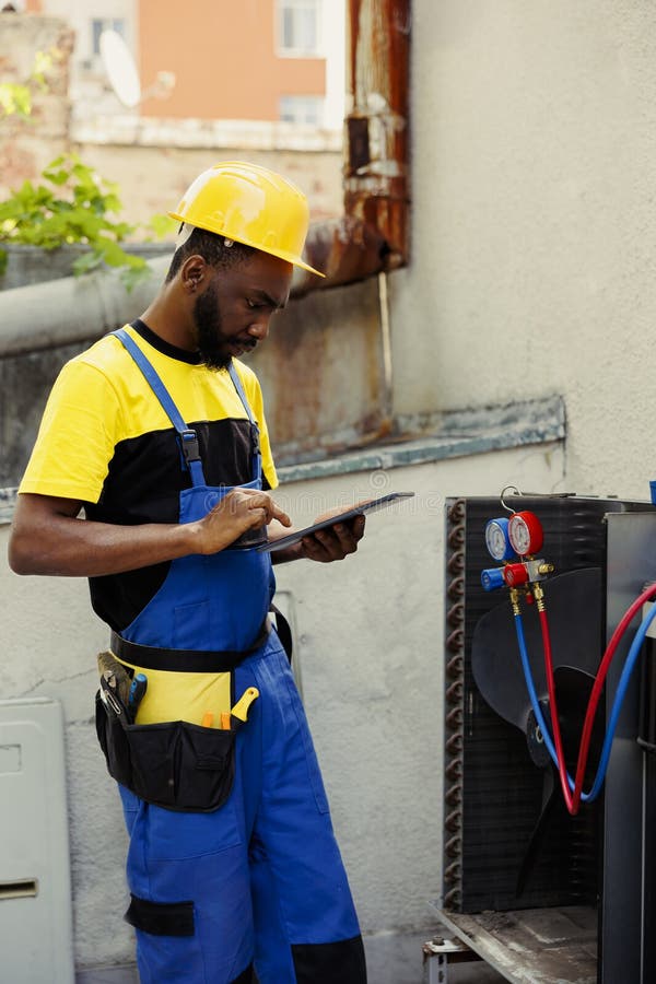 Repairman Doing Condenser Investigations Stock Photo - Image of ...